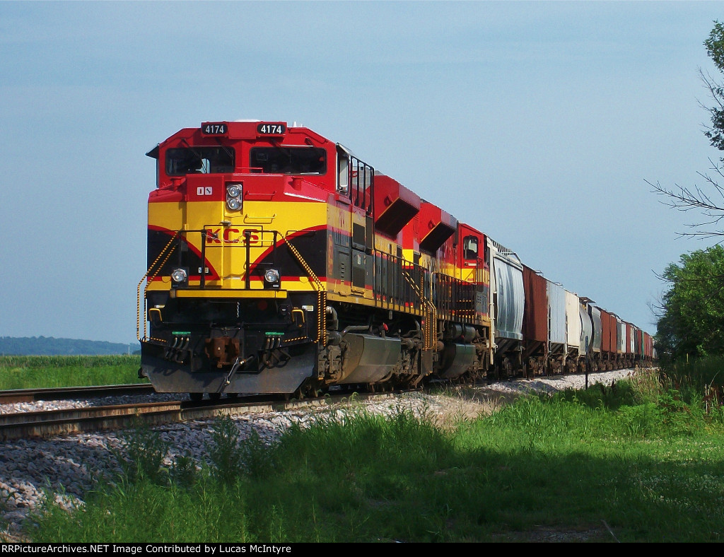 KCS 4174 tied down westbound KCS empty grain train